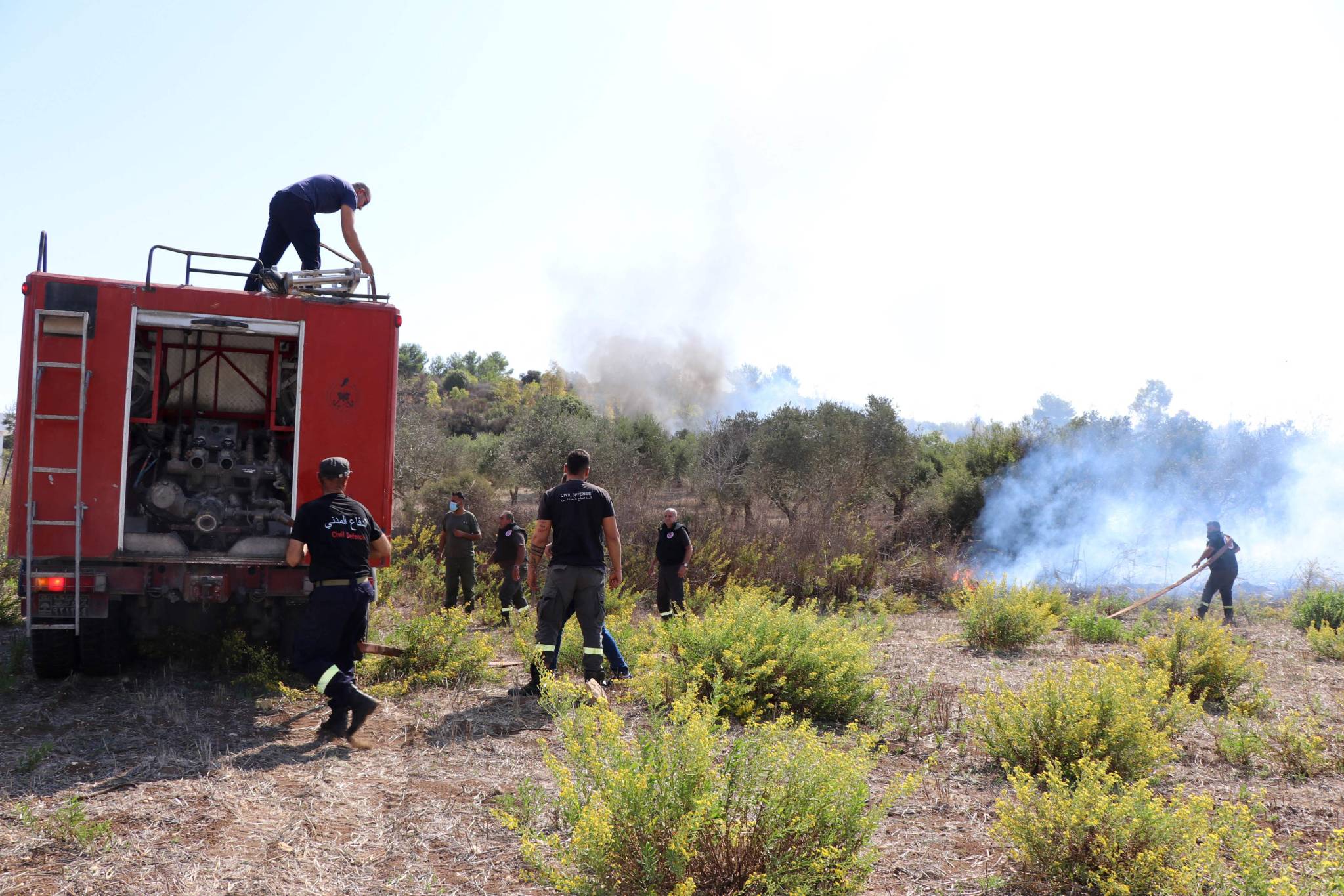 Civil Defense, others fight to extinguish Alma al-Shaab fire caused by ...