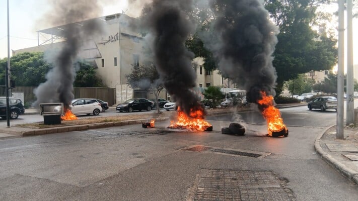Civil servants and retired military block roads in Beirut and the North ...